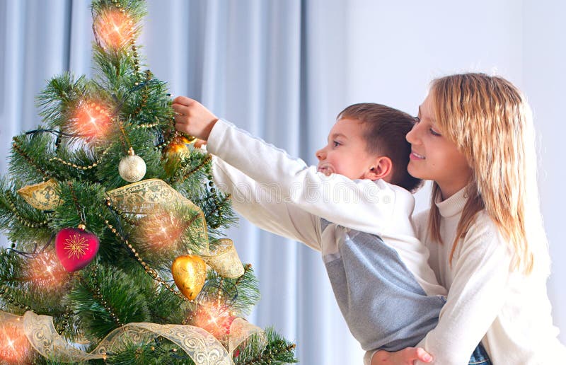 Kids Decorating Christmas Tree Stock Photo - Image of male, kids: 27874992