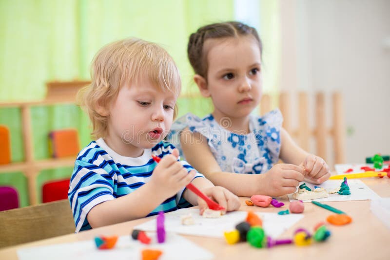 Kids Doing Arts and Crafts. Children in Kindergarten. Stock Image ...