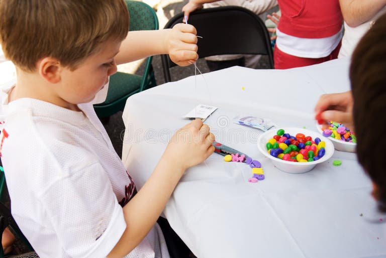 Kids doing crafts stock image. Image of colors, stringing - 4673511