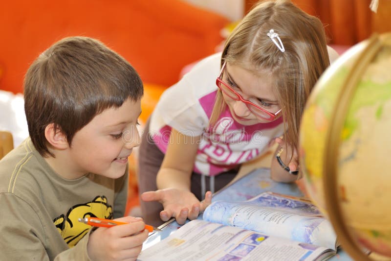 Kids doing some homework stock photo. Image of notebook - 62388710