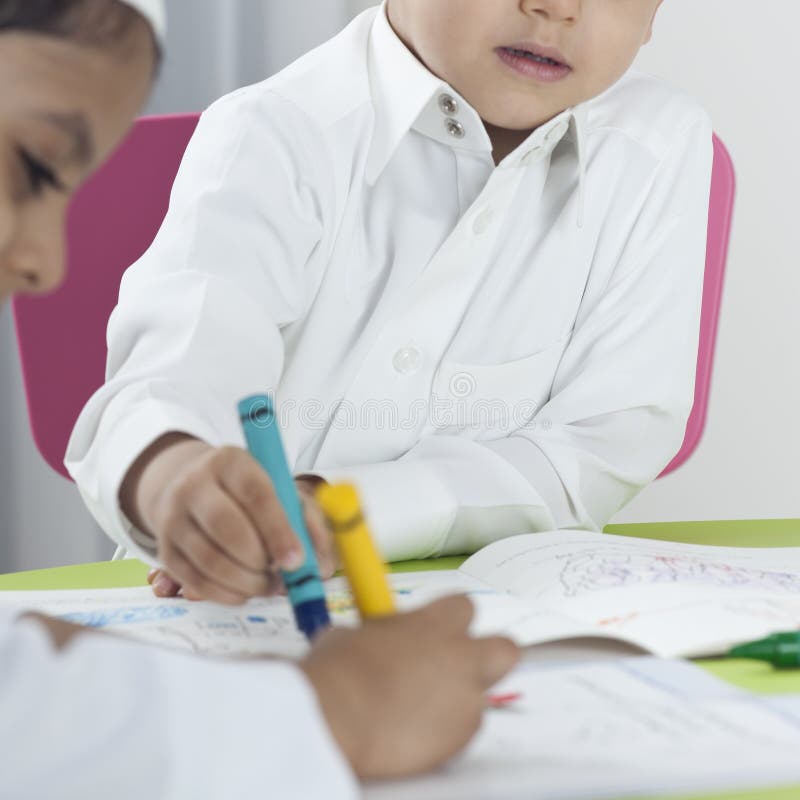Kids Drawing with Colored Crayons at a Table Editorial Stock Image ...