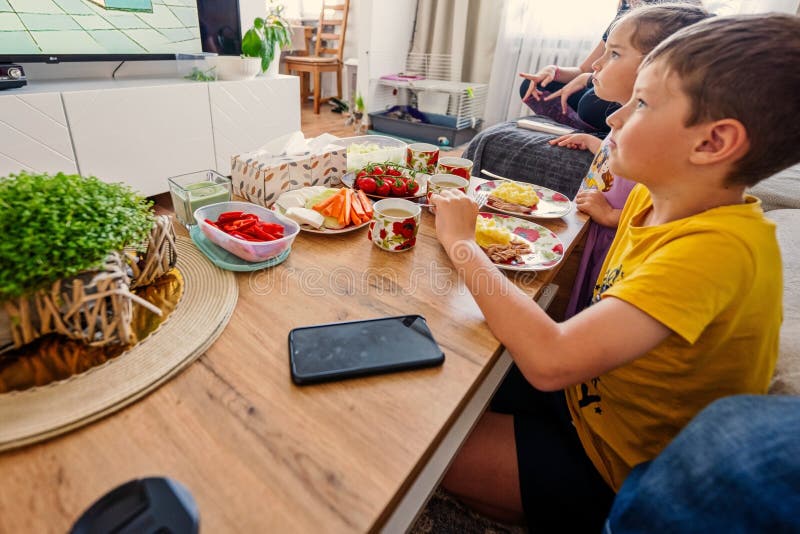 Kids Eating at Home and Watching Tv Stock Photo - Image of family, life ...