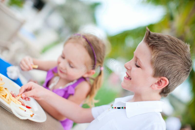 Kids eating lunch stock image. Image of child, delicious - 27488157