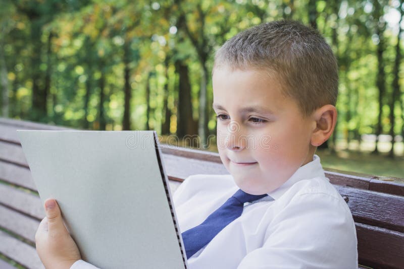 Kids Educations Concept, Boy with a Notebook in Hand and a Pencil Stock ...