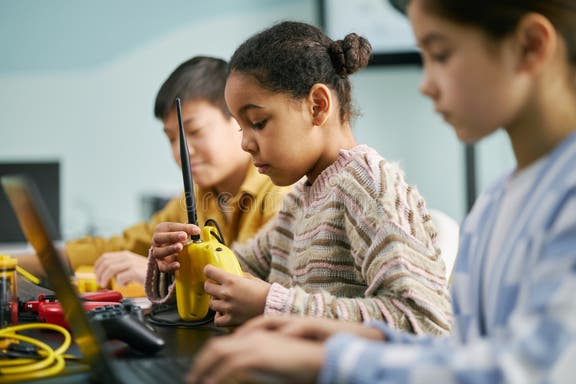 Kids Engaging in STEM Activities with Gadgets in Classroom Stock Image ...