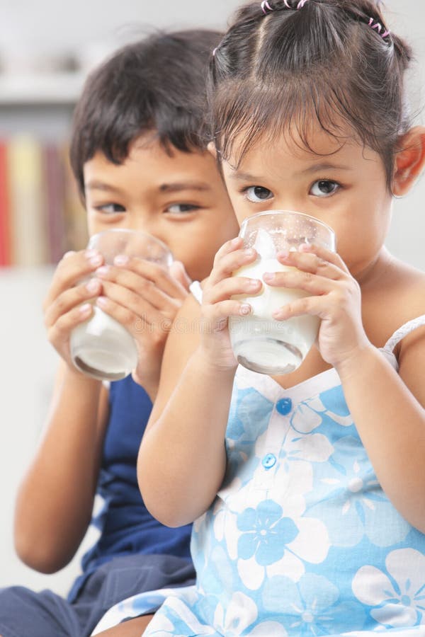 Kids enjoy drinking milk stock image. Image of learning - 12601633