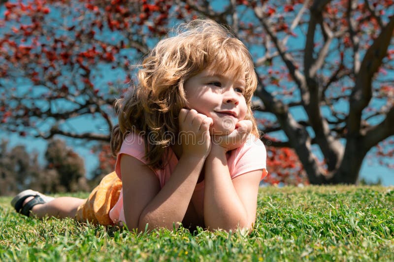 Kids Face, Little Boy Laying on Grass. Stock Photo - Image of child ...