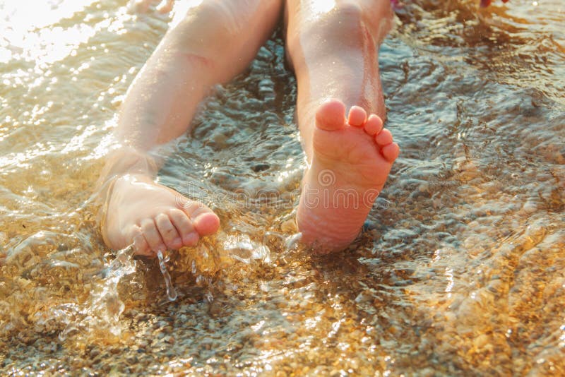 Kids Feet on the Beach in the Water Stock Photo - Image of sand ...