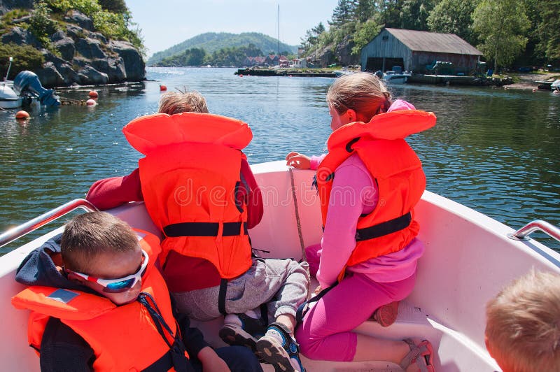 Kids floating in a boat stock image. Image of smiling - 55467875