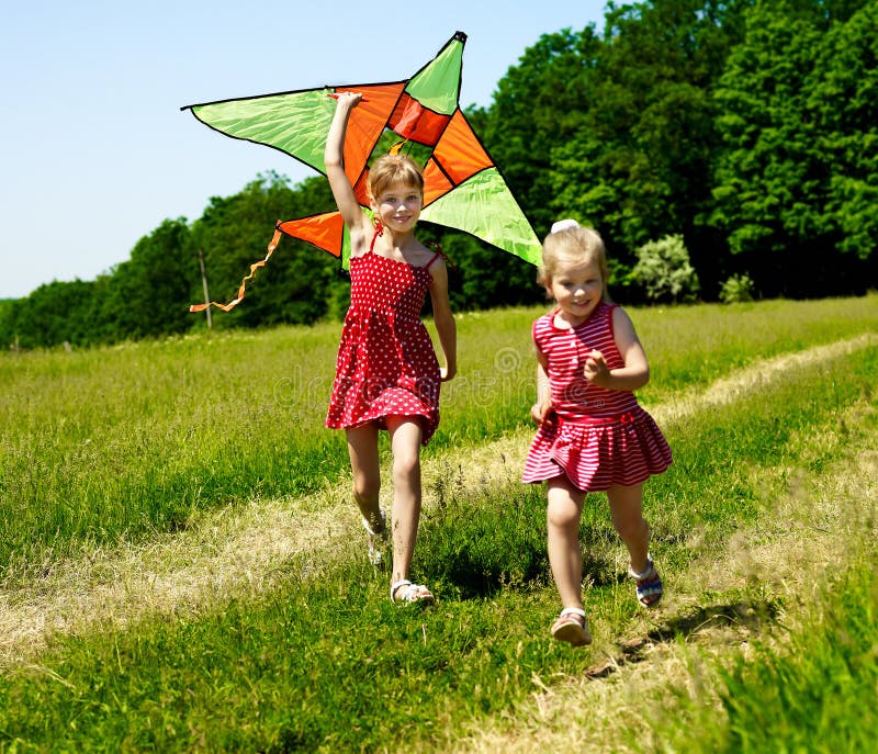 Kid flying kite outdoor. stock photo. Image of kite, green - 19848470