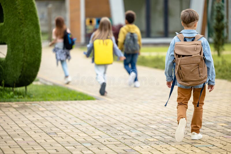 Kids Getting Out of the School after the Lessons Stock Photo - Image of ...