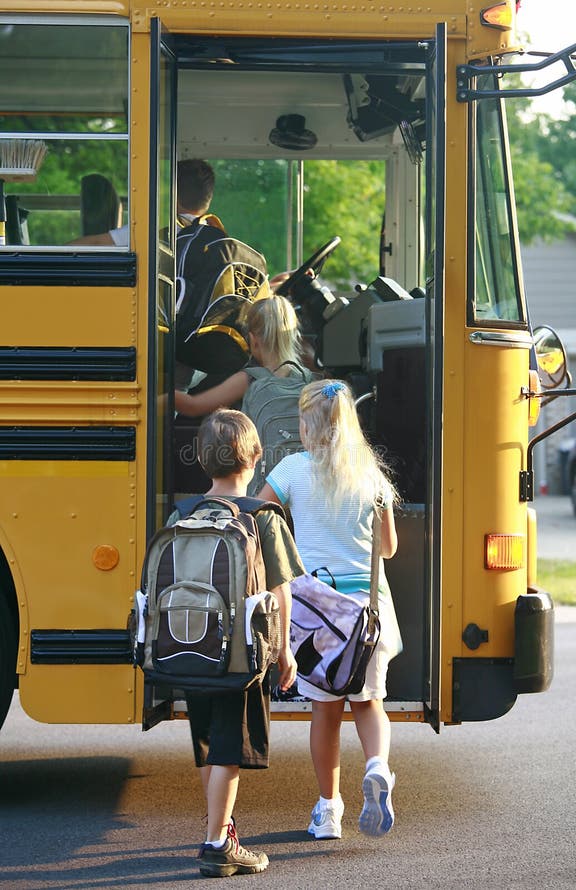 Kids Getting on School Bus stock image. Image of group - 3058523