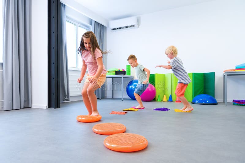 Kids Group Physio Therapy. Children Exercising during Session ...