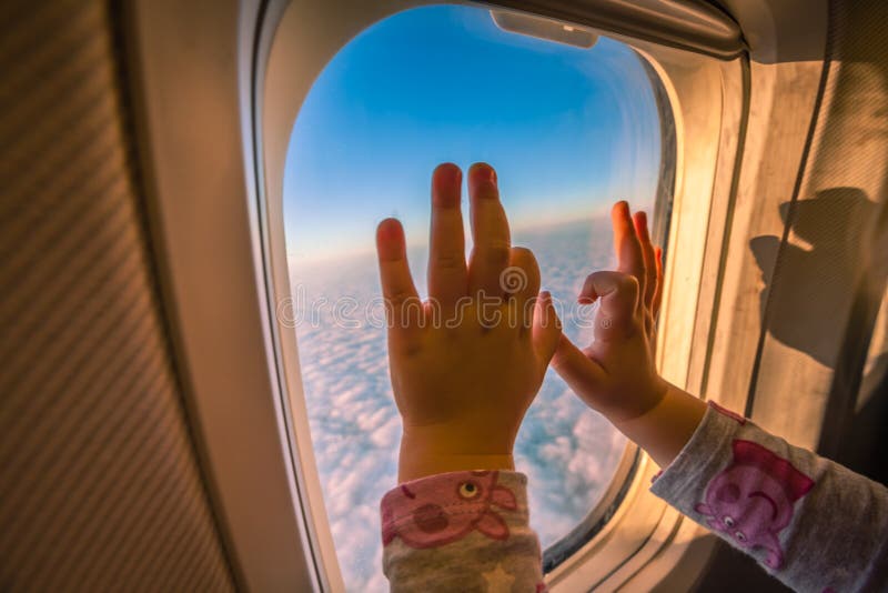 Kids Hands on the Plane Window Editorial Image - Image of clouds ...