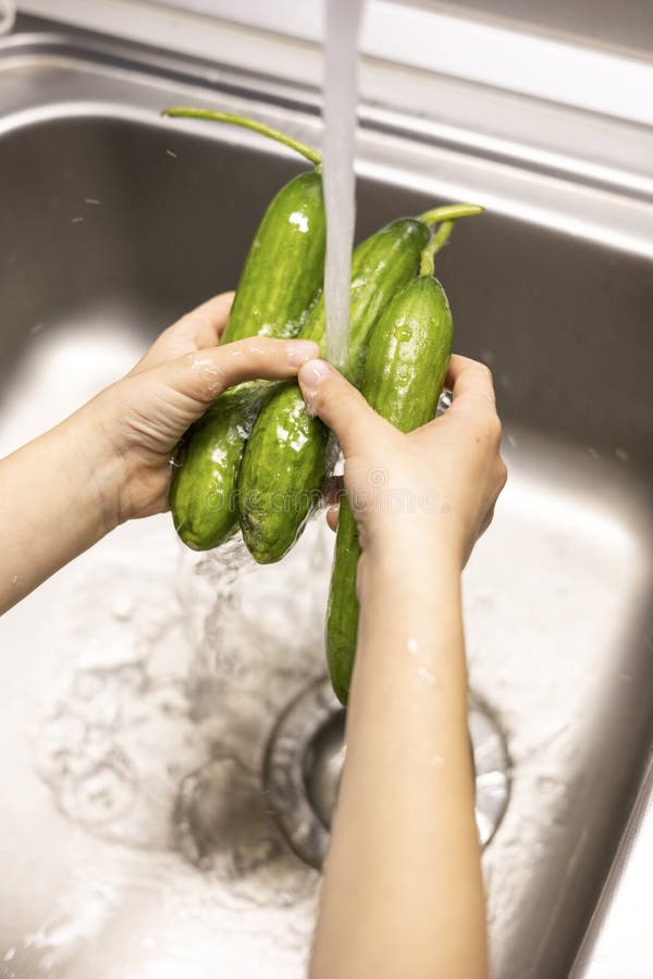 Kids Hands Washing Cucumber in the Kitchen Close Up Stock Image - Image ...