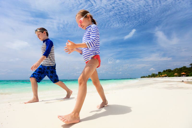 Kids having fun at beach stock photo. Image of child - 44025854