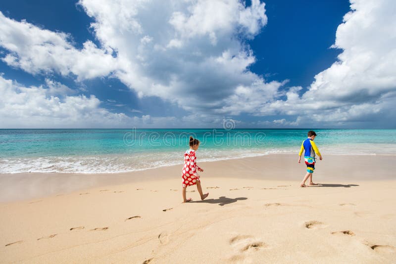 Kids having fun at beach stock image. Image of ocean - 65202535