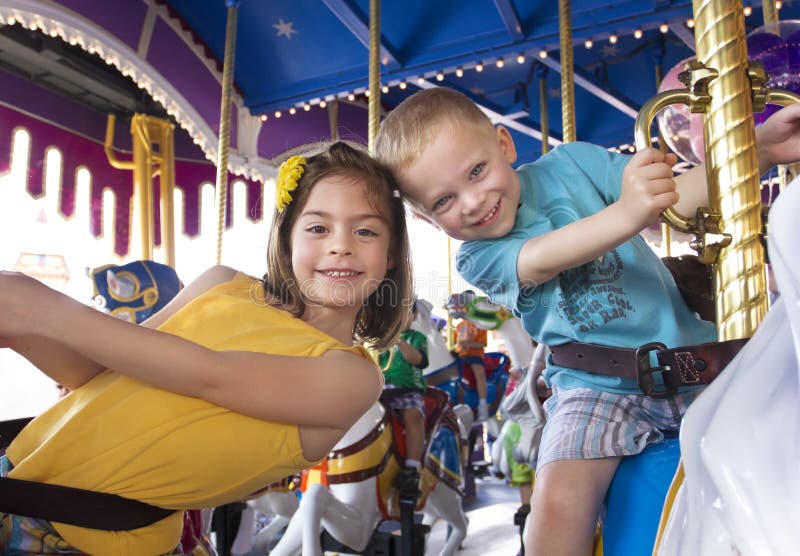 Kids Having Fun on a Carnival Carousel Stock Photo - Image of ride ...