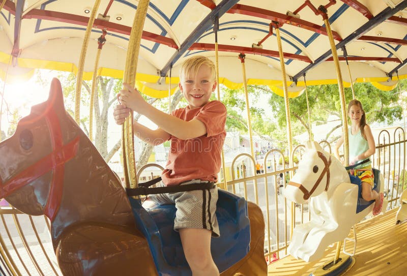 Kids Having Fun on a Carnival Carousel Stock Photo - Image of afternoon ...