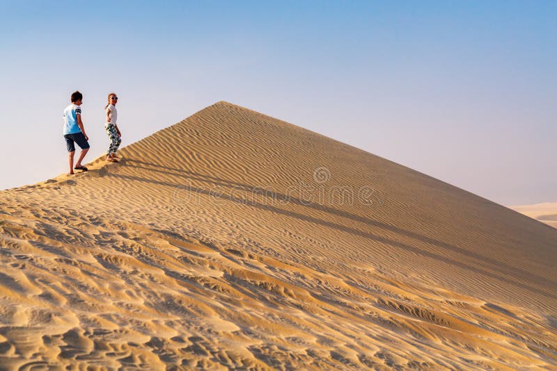 Kids having fun at desert stock photo. Image of happiness - 100497952