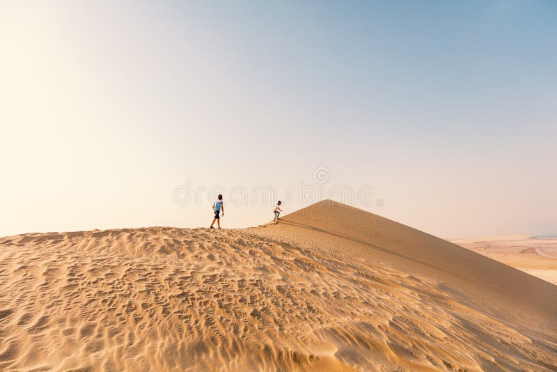 Kids having fun at desert stock photo. Image of adorable - 150758592