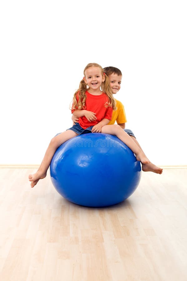 Kids Having Fun and Exercises with a Large Ball Stock Photo - Image of ...