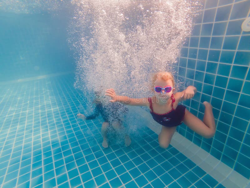 Kids Having Fun Playing Underwater in Swimming Pool on Summer Vacation ...