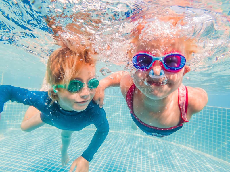 Kids Having Fun Playing Underwater in Swimming Pool on Summer Vacation ...