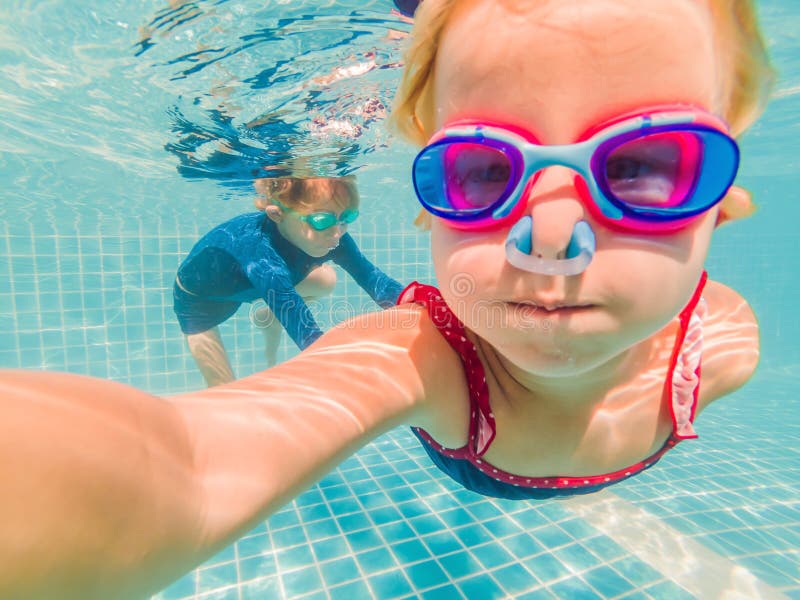 Kids Having Fun Playing Underwater in Swimming Pool on Summer Vacation ...