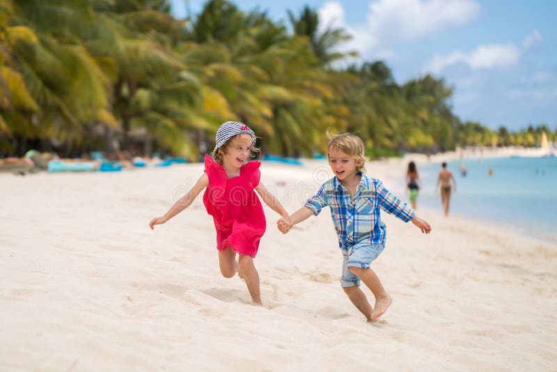 Kids Having Fun Running Together in the Beach. Stock Image - Image of ...