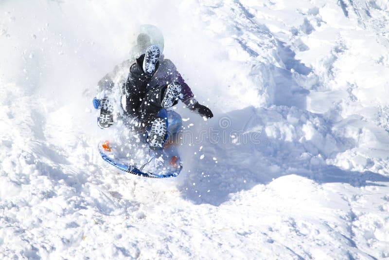 Kids Having Fun in the Snow Sliding Stock Photo - Image of cold ...