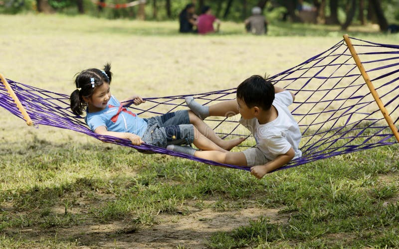Kids Having Great Fun in Hammock Stock Photo - Image of asian, laughing ...