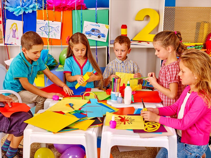 Kids Holding Colored Paper on Table in Kindergarten . Stock Photo ...