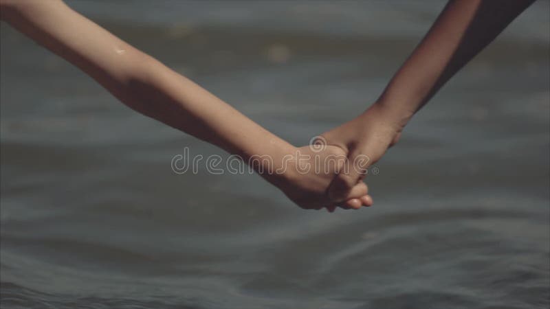 Mom and Dad with Two Kids Holding Hands of Each Other and Running ...