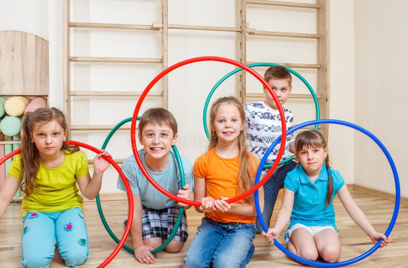 Kids holding hula hoops stock photo. Image of happiness - 31847140