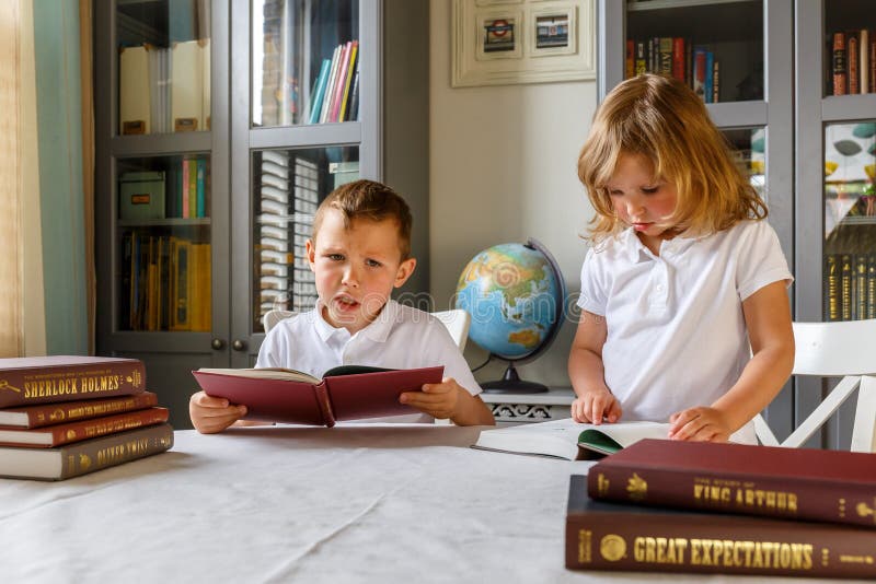 Kids at homework stock image. Image of english, cute - 71798299