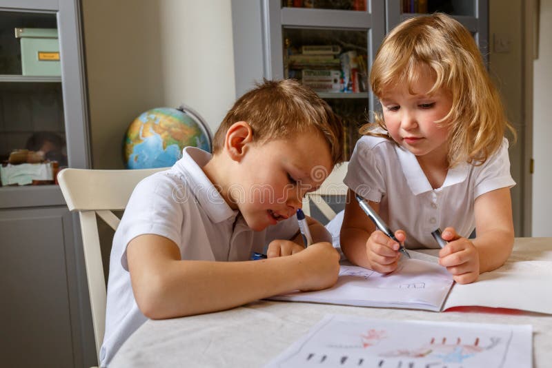 Kids at homework stock photo. Image of emotion, childhood - 71798334