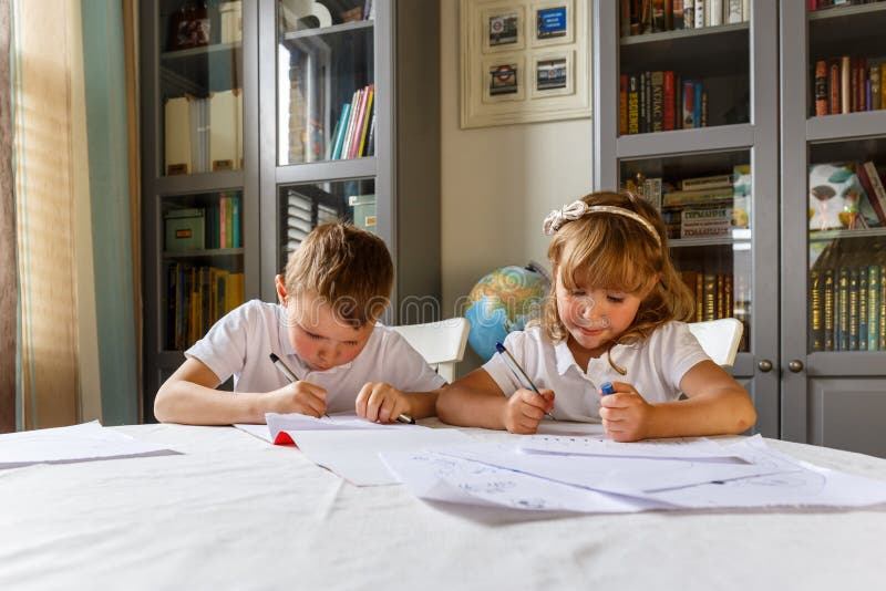 Kids at homework stock photo. Image of britain, cute - 71798420