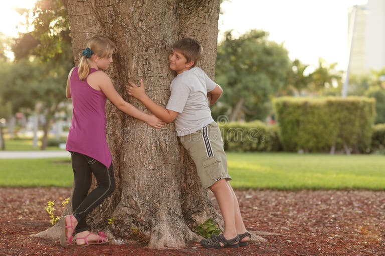 Kids hugging the tree stock image. Image of couple, female - 16760995