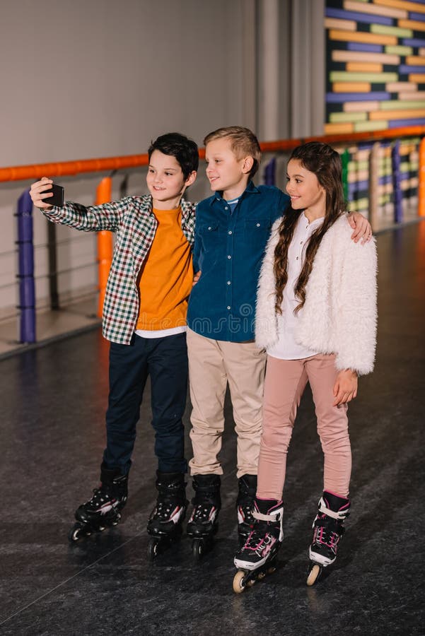 Kids Hugs on Roller Rink and Stock Photo - Image of caucasian, girlhood ...