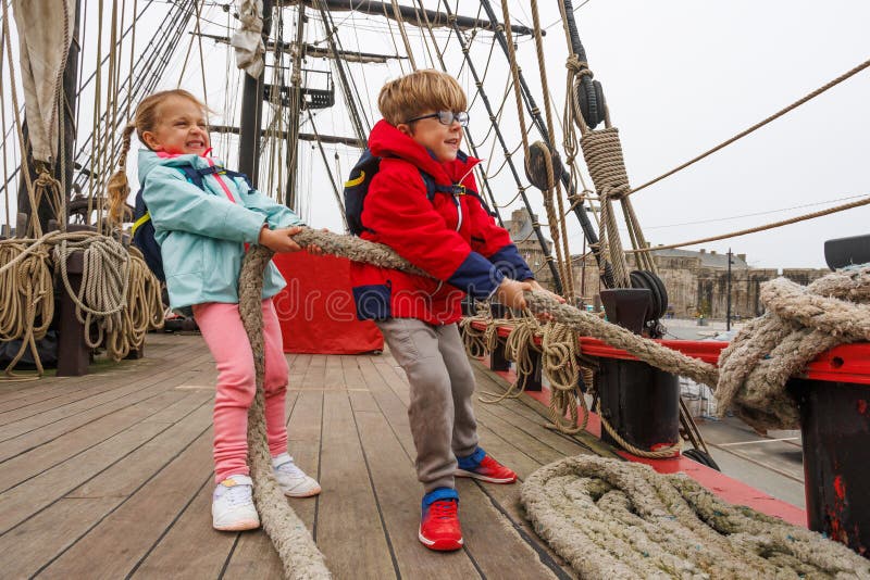 Kids Joyfully Pulling a Rope on Ship Deck Adventure Attraction Stock ...