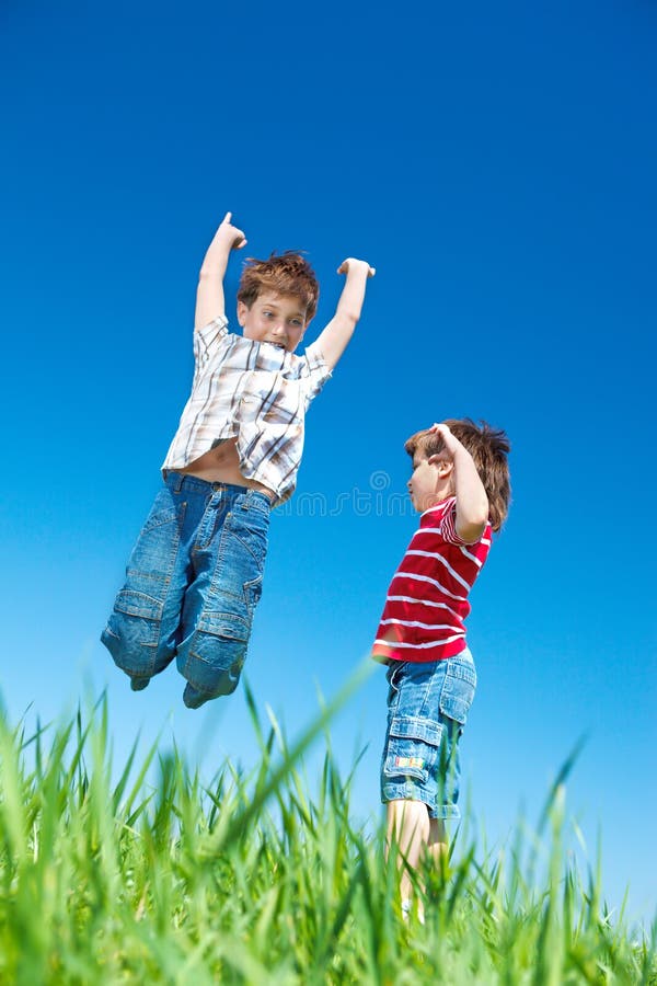 Happy Smiling Children Jumping Stock Photo - Image of summer, friends ...