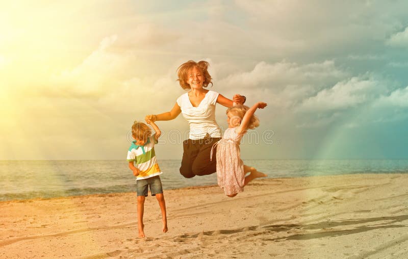 Kids Jumping on the Ocean Beach Stock Image - Image of recreation ...