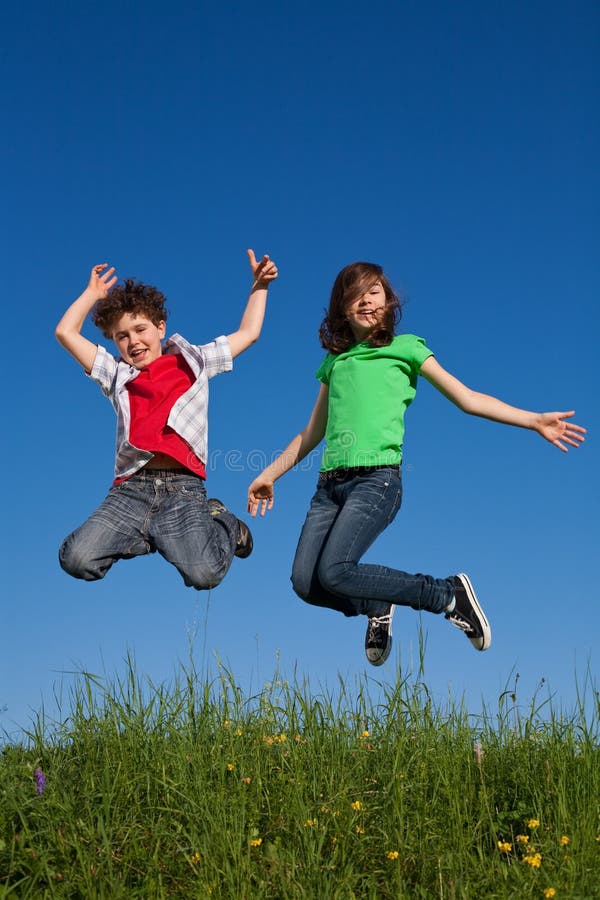 Kids jumping outdoor stock image. Image of leap, female - 10781141