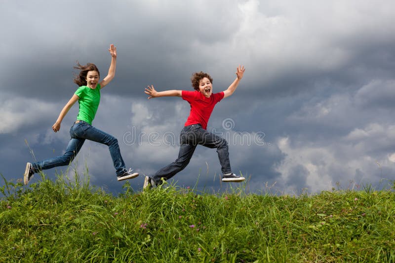 Kids jumping outdoor stock photo. Image of enjoyment, joyful - 9088816