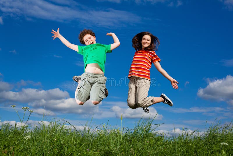 Kids jumping outdoor stock photo. Image of blue, jump - 17774926