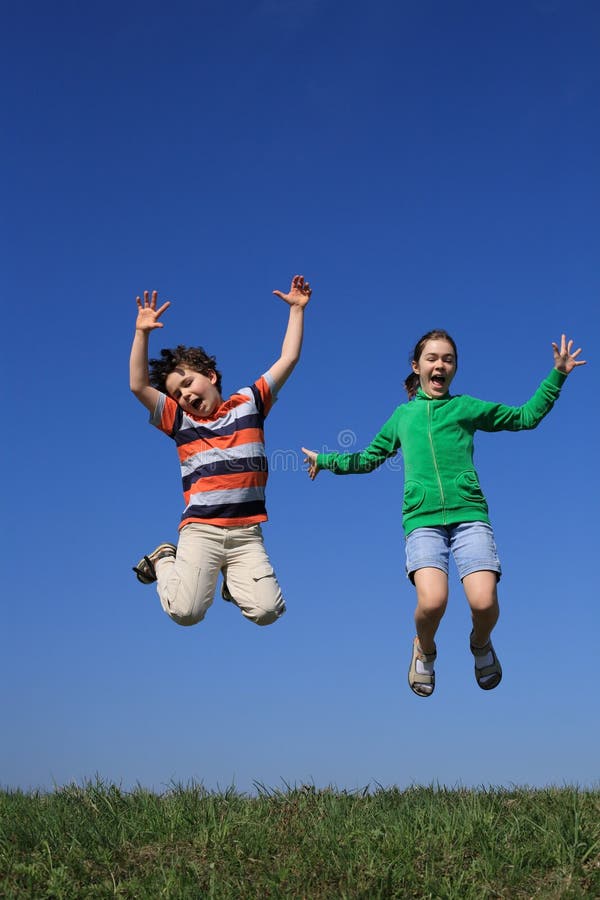 Kids jumping outdoor stock photo. Image of enjoyment, joyful - 9088816