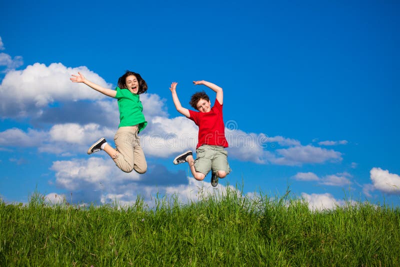 Kids jumping outdoor stock photo. Image of enjoying, leap - 55414816