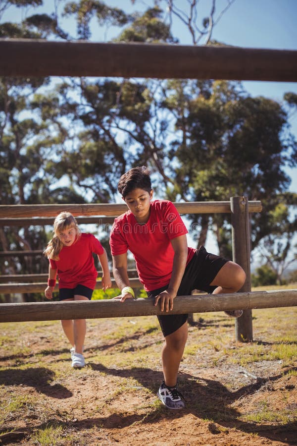 Kids Jumping Over the Hurdles during Obstacle Course Training Stock ...
