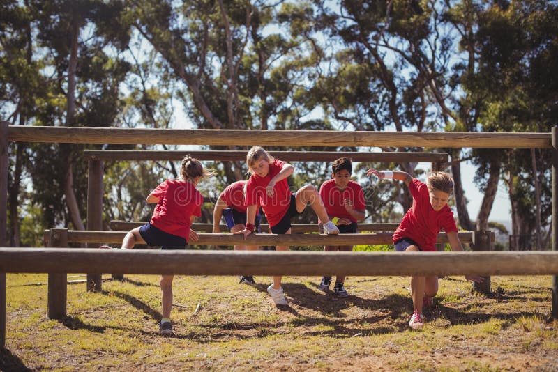 Kids Jumping Over the Hurdles during Obstacle Course Training Stock ...